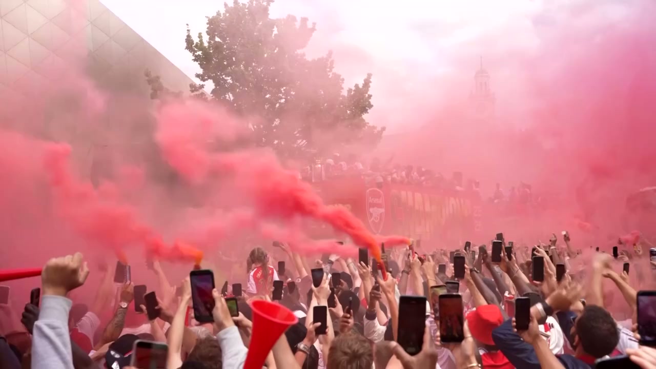Arsenal fans celebrate Premier League win with open-top bus parade