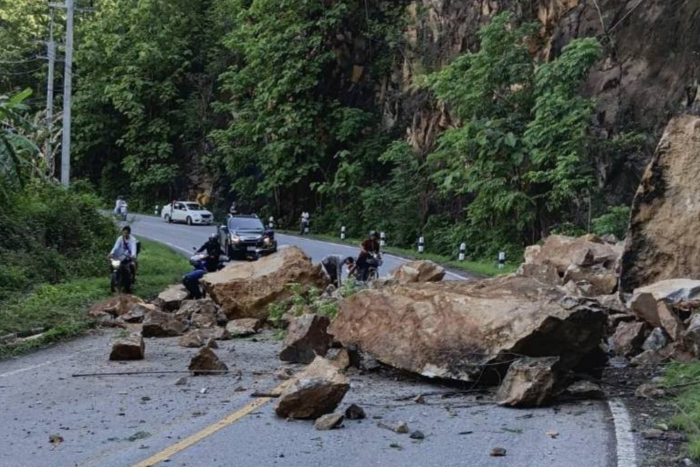 Huge fallen rock blocks mountain road in Mae Hong Son