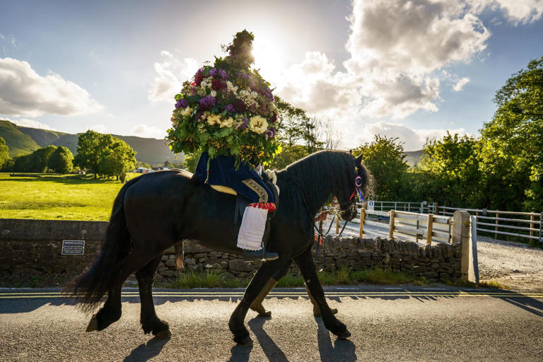Pictures: Peak District marks ancient tradition as 'king' decked in ...