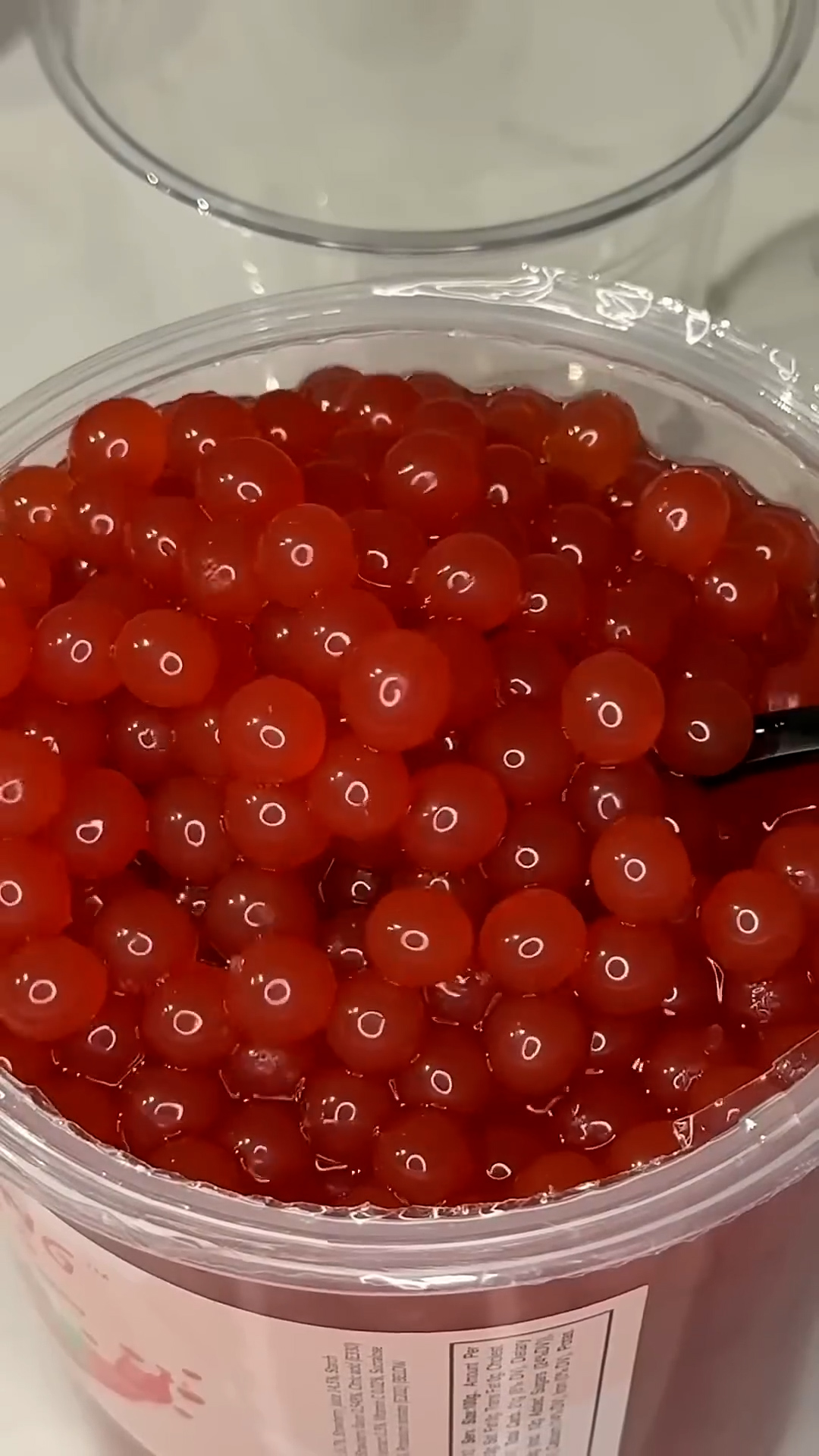 Homemade strawberry popping boba bursts with juice in every bite