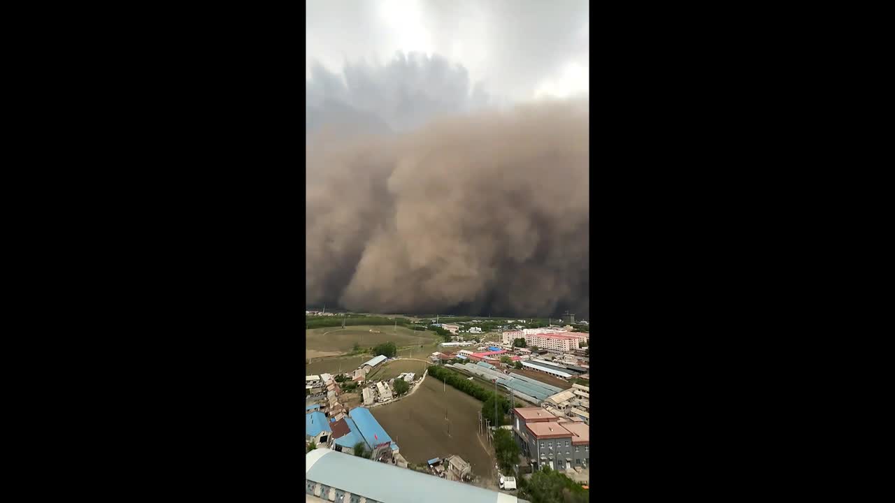 High-rise resident films as massive wall of sand engulfs Chinese city
