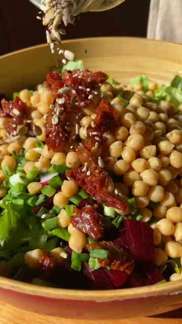 Healthy and colorful salad with beets, chickpeas, and radishes