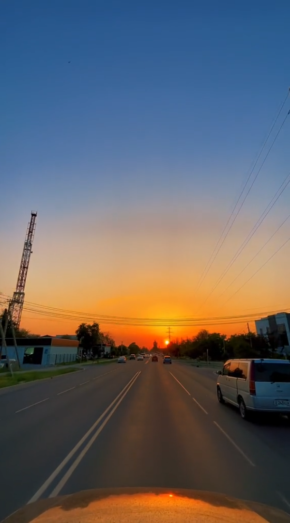 Serene sunset captured from a moving vehicle
