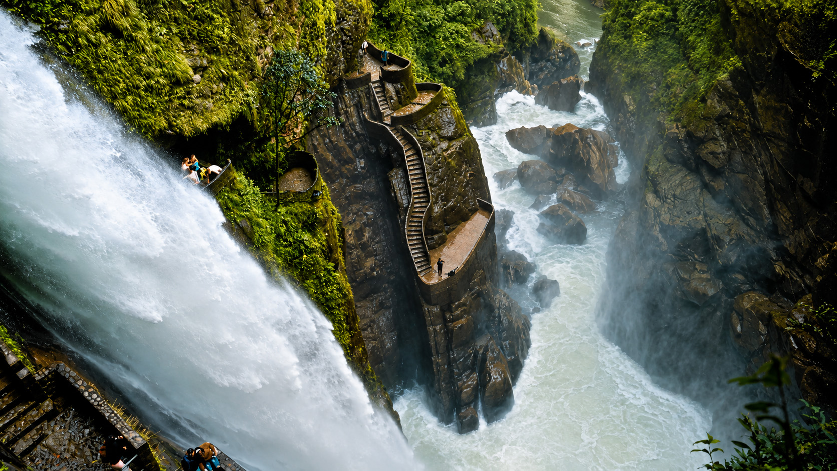 A cliffside waterfall dropping through Baños de Agua Santa