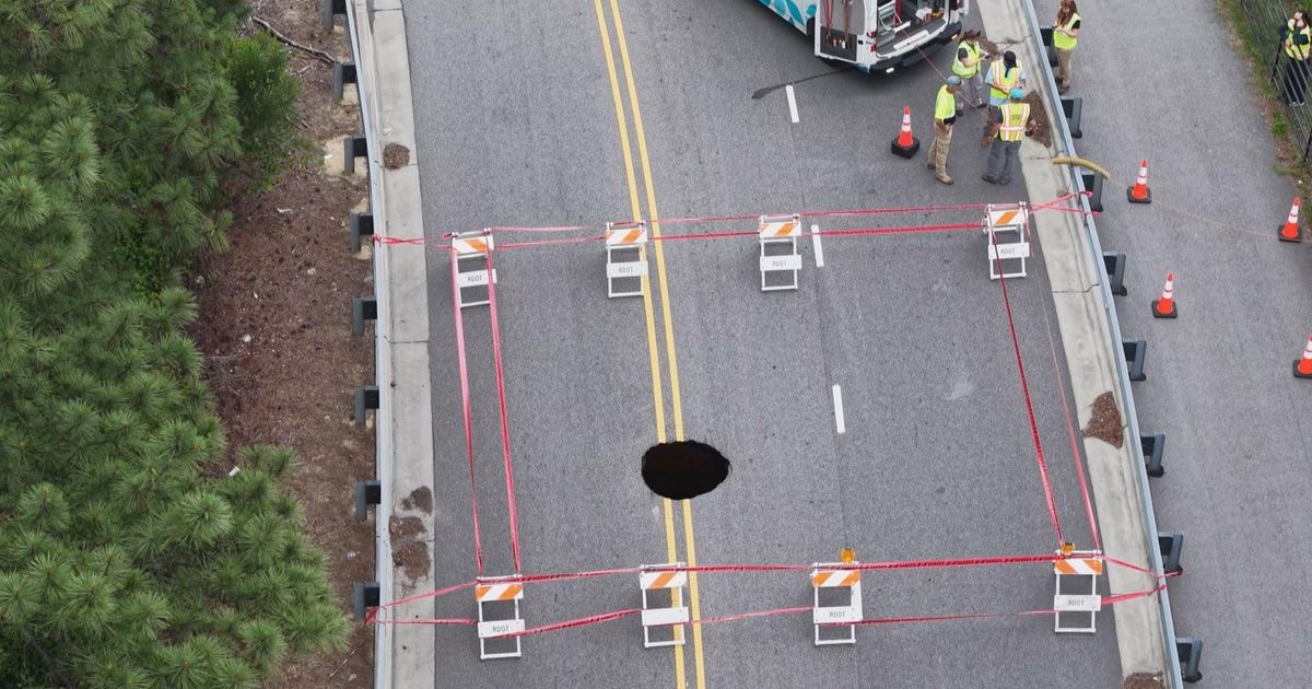 Large sinkhole blocks traffic on Yonkers Road in Raleigh