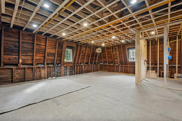 For $579k, an unfinished 1800s carriage house condo