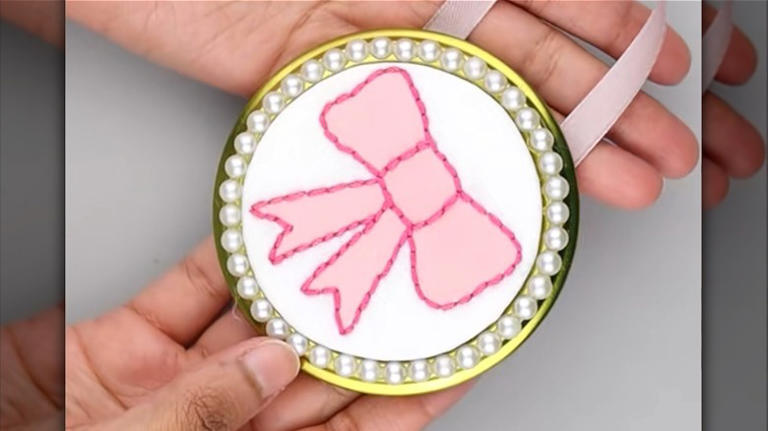Don't toss old jar lids — make adorable DIY wall decor instead