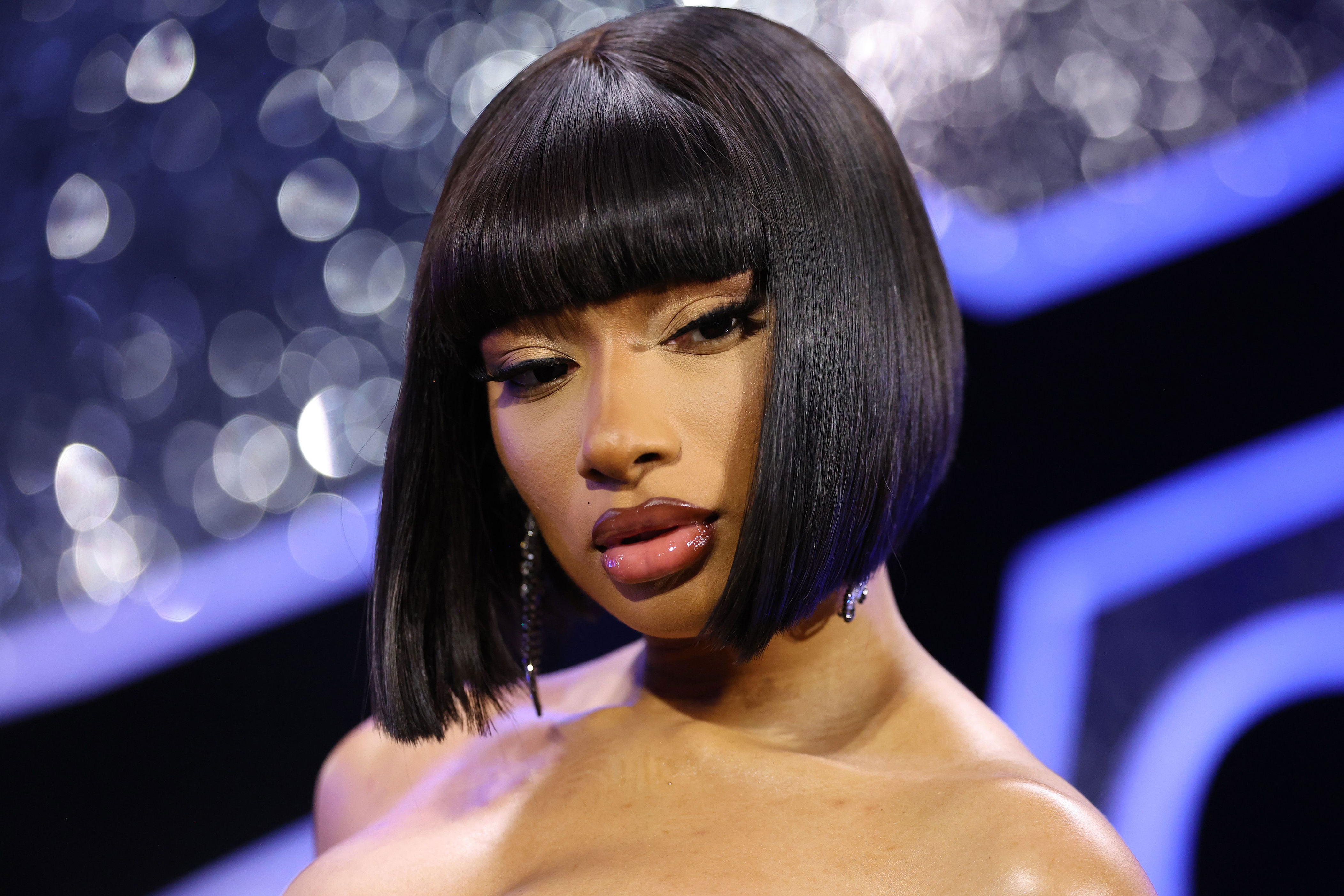 I can see Megan Thee Stallion's neon green hair from across the country
