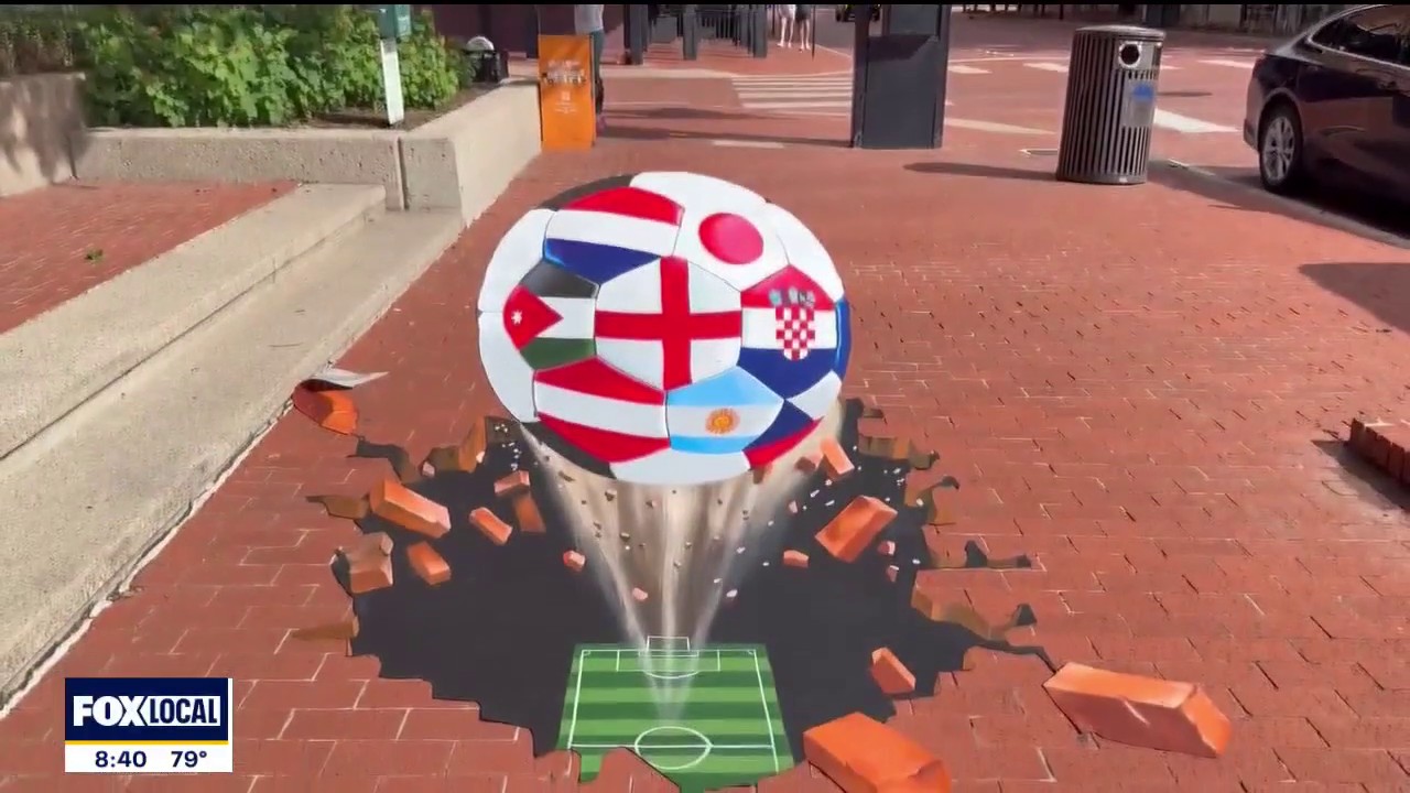 Artist creates sidewalk art for World Cup