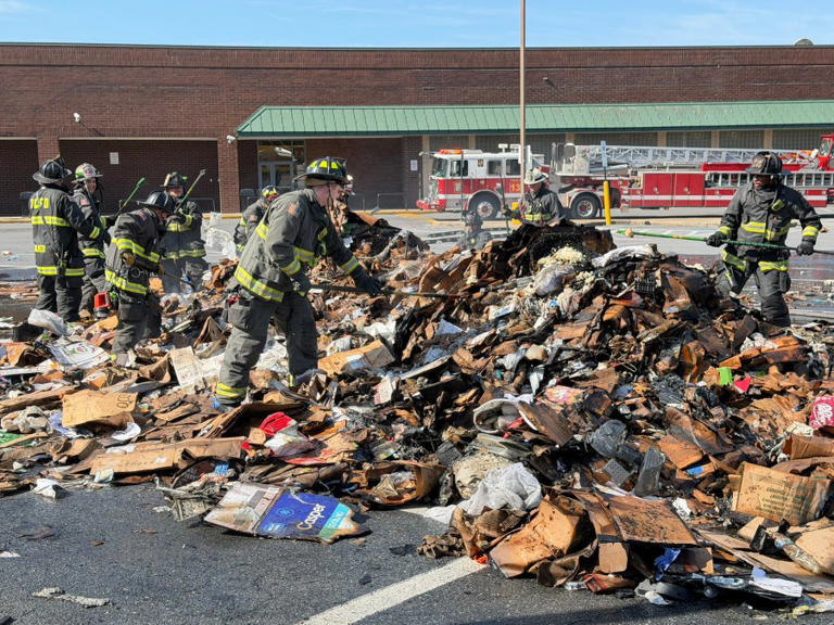 Garbage truck dumps trash in parking lot after fire in DC