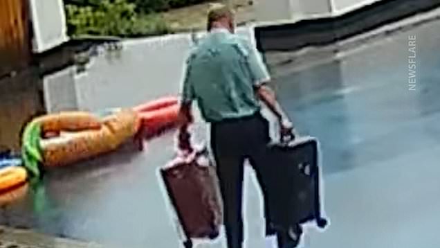 Hotel porter accidentally walks straight into swimming pool