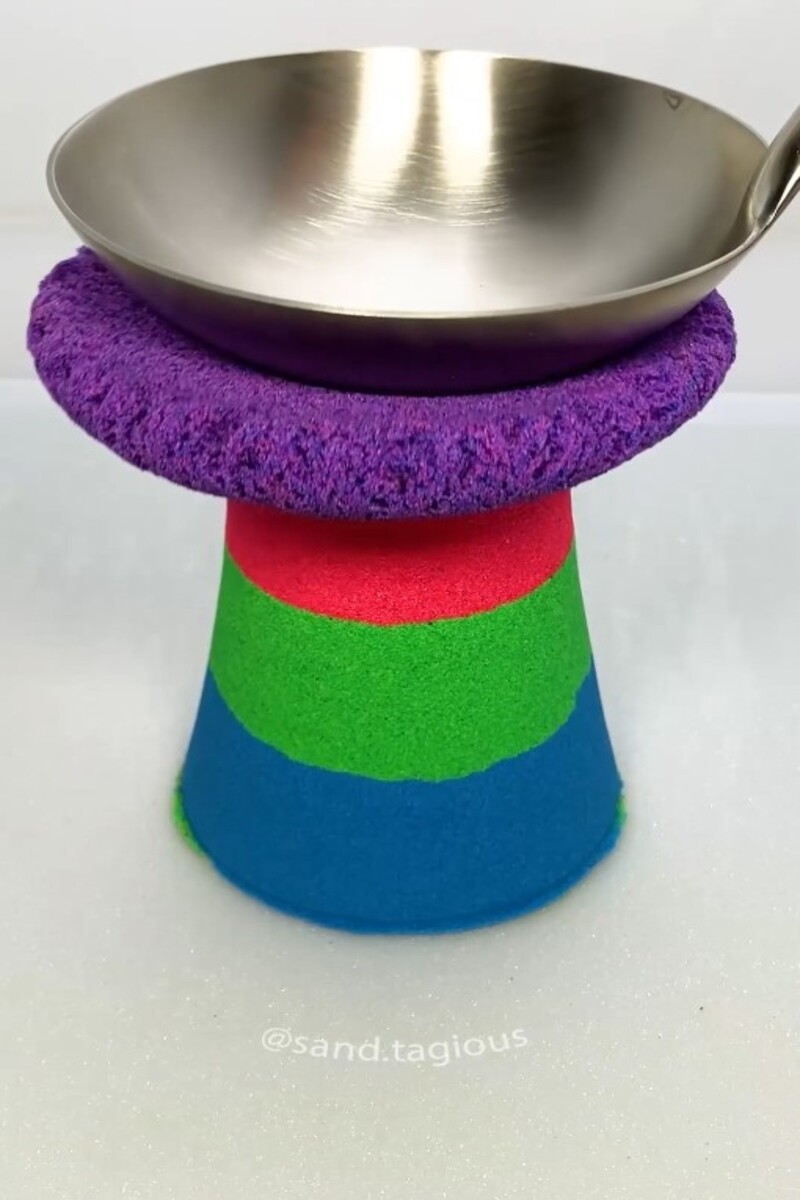 Colorful sand sculpture with bowl