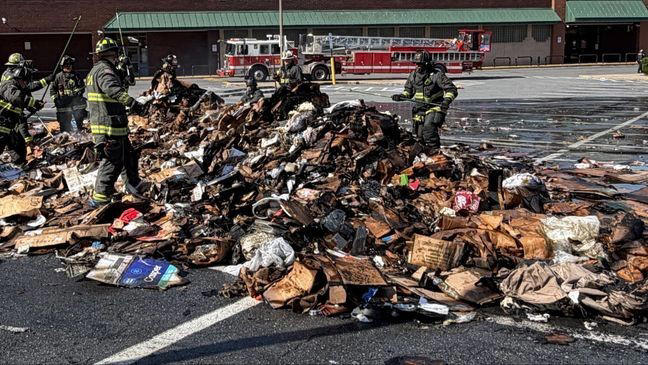 Trash truck load catches fire in Northeast DC