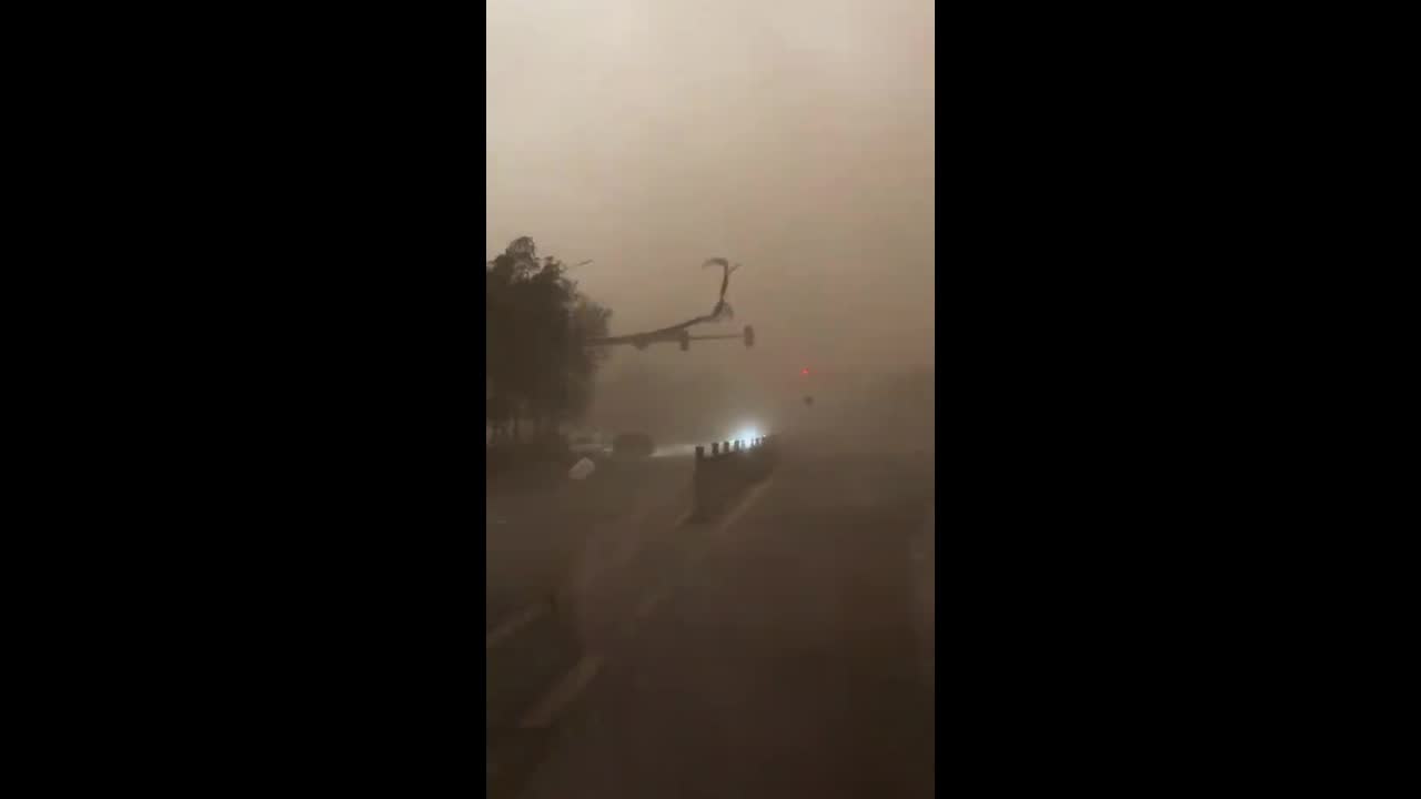 Dust storm reduces visibility on city roads in Harbin, Heilongjiang, China
