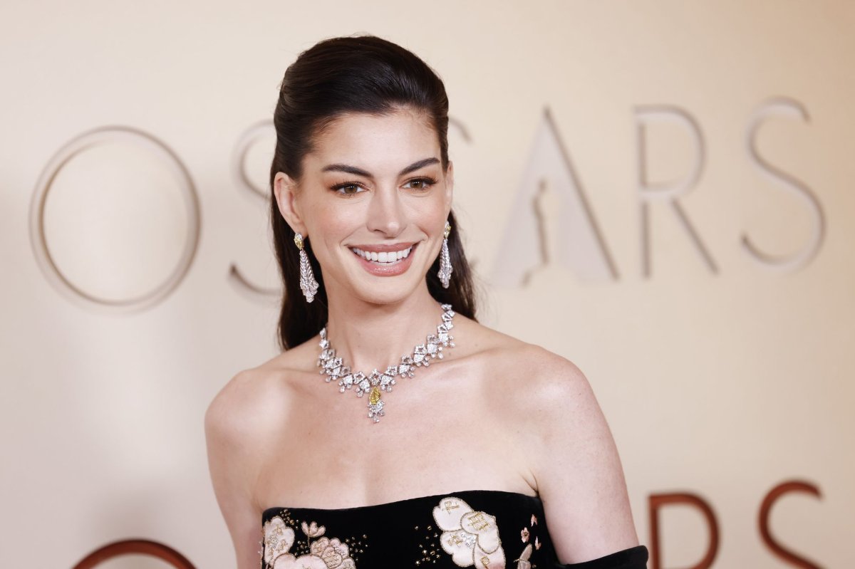 Watch: Anne Hathaway takes on dinosaurs in 'End of Oak Street'