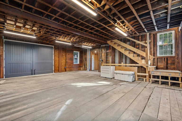 For $579k, an unfinished 1800s carriage house condo
