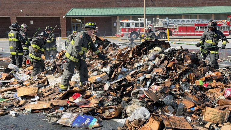 Trash truck load catches fire in northeast DC
