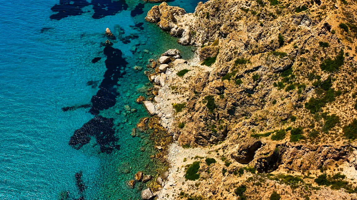 Hidden coastal beauty with clear waters and natural rock formations