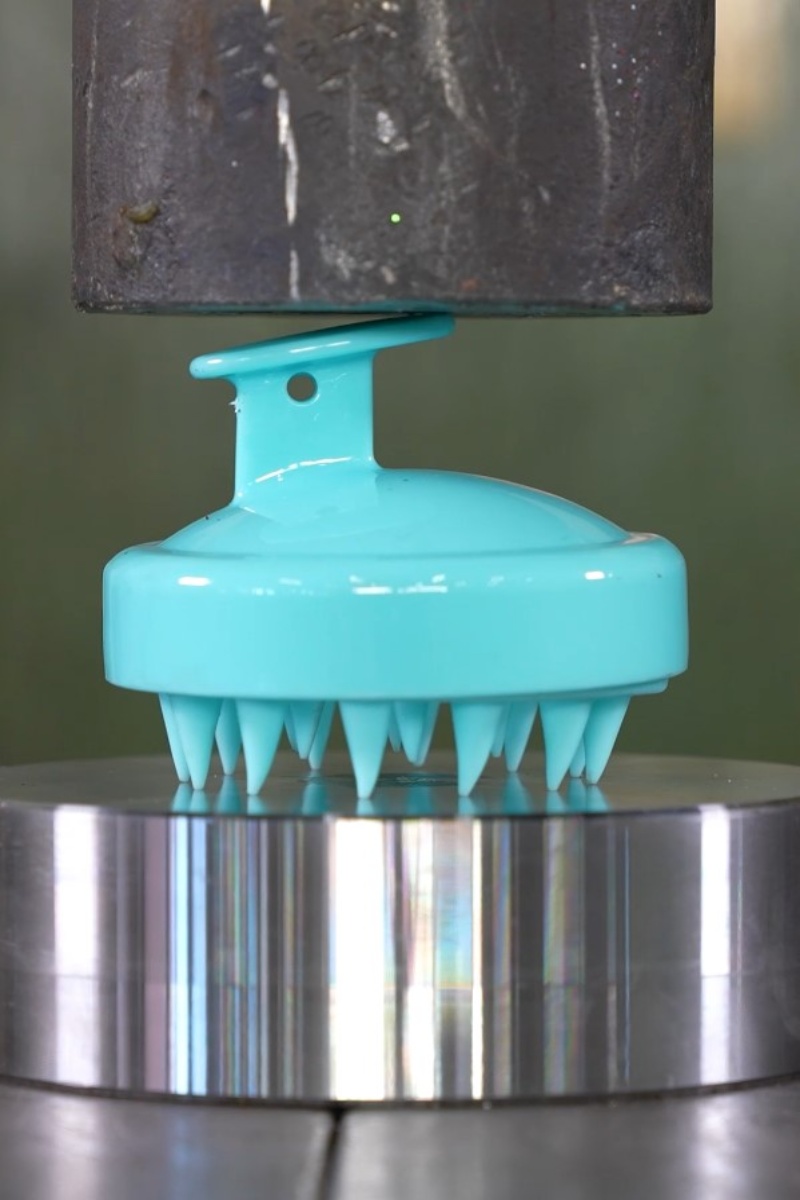 Crushing a scalp massager with hydraulic press