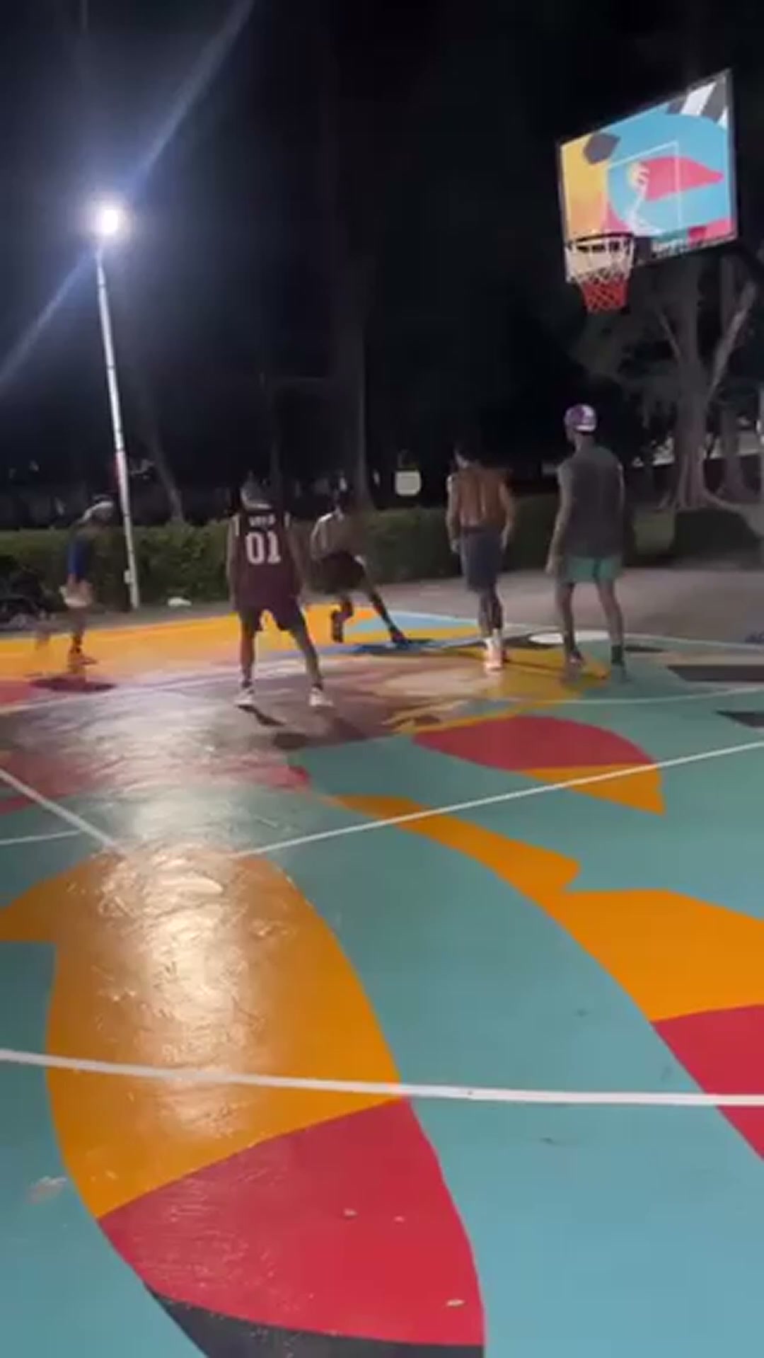 Intense night basketball game on a vibrant court