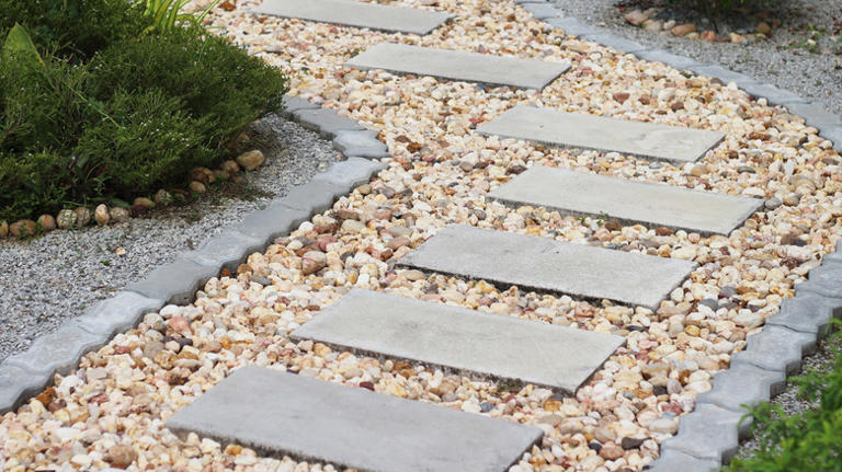 Use an old pebble collection to DIY budget-friendly pavers in the garden