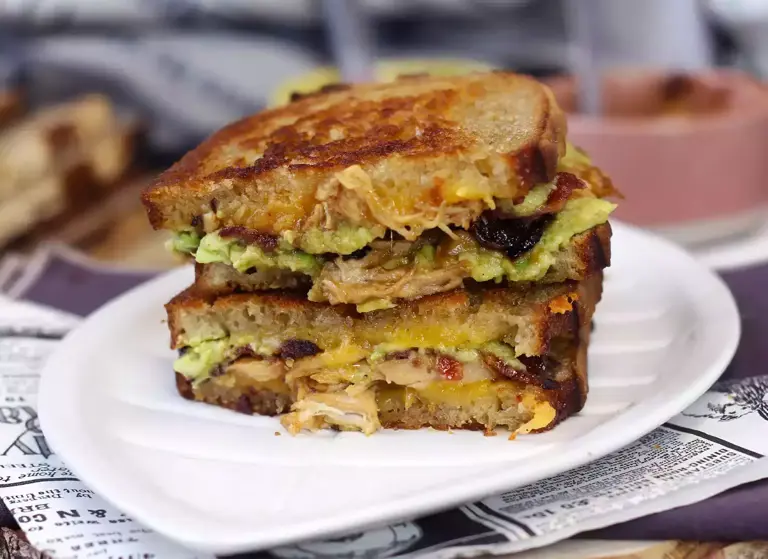 Maxi grilled cheese sandwich: cheddar, shredded chicken, avocado, bacon