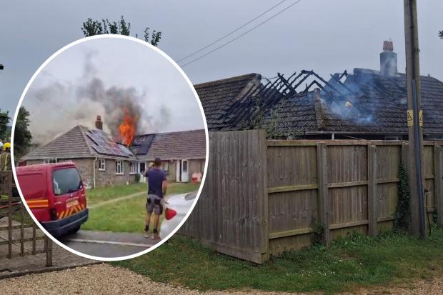 Roof destroyed and residents evacuated as firefighters tackle bungalow ...
