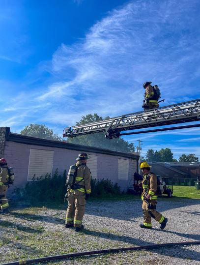 Flames destroy Canton building, 1 firefighter suffers minor injuries