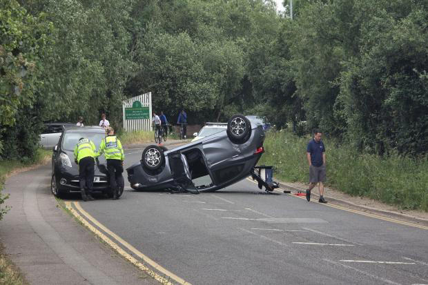 Emergency services at scene of overturned car