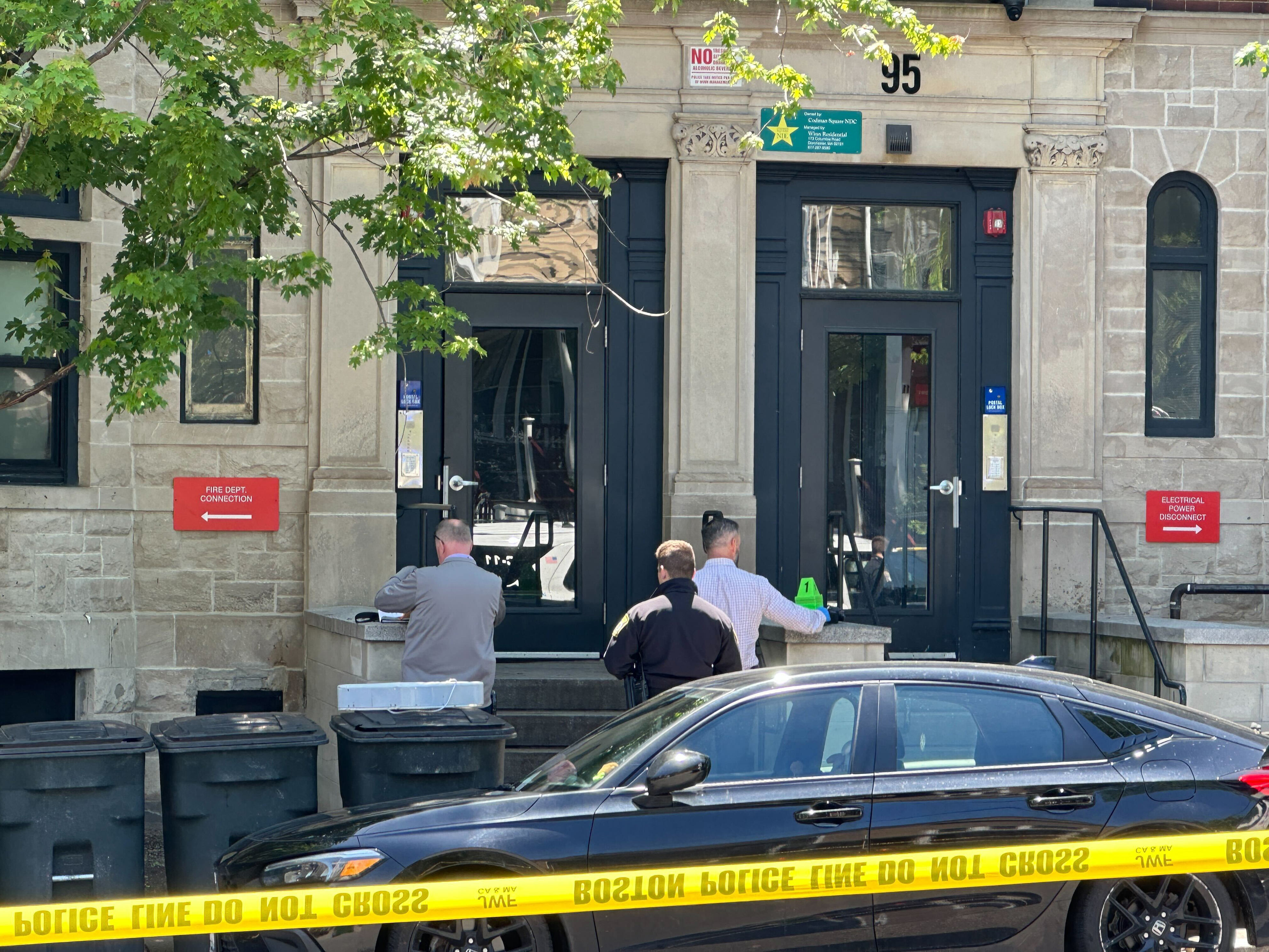 Police investigators seen near homes in Dorchester