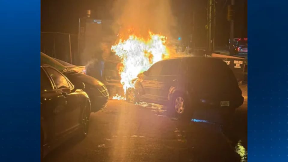 RAW: Car crashes into parked vehicles, catches fire at used auto sales ...