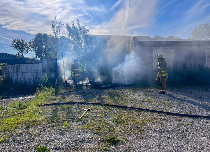 Flames destroy Canton building, 1 firefighter suffers minor injuries