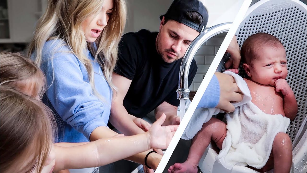 Parents navigate chaos during the baby's first bath time