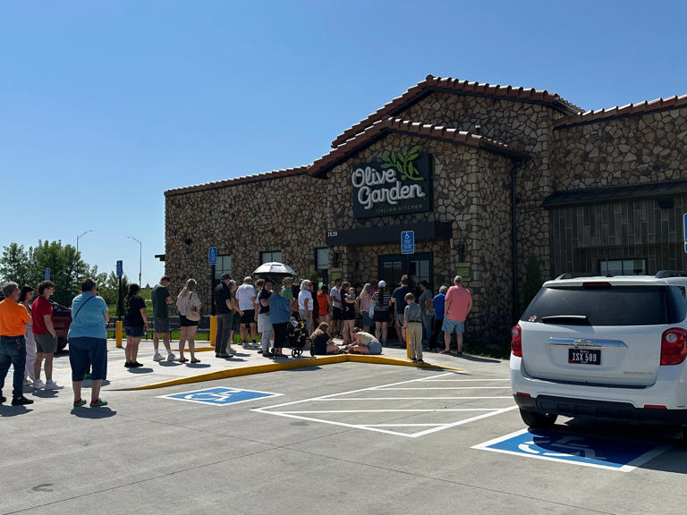 Nearly 60 people flocked to Ames' Olive Garden as it opened the doors