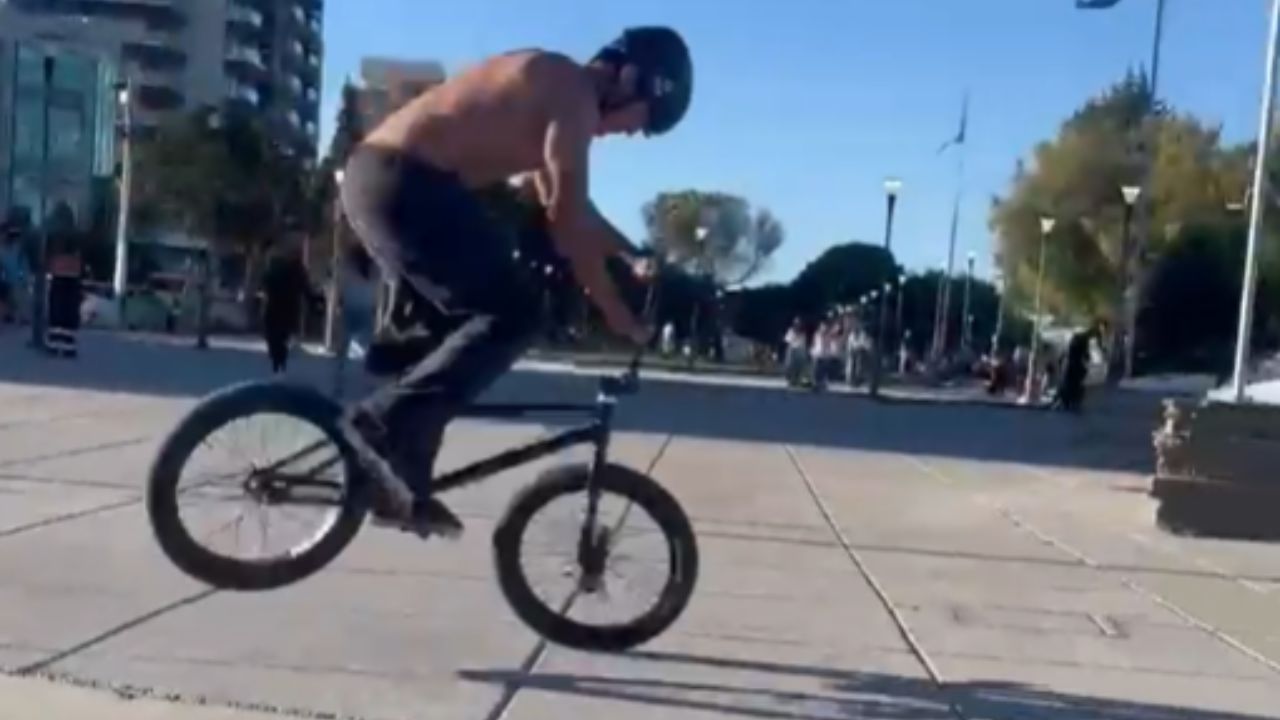 Boy tries front wheel trick on a bicycle and falls hard