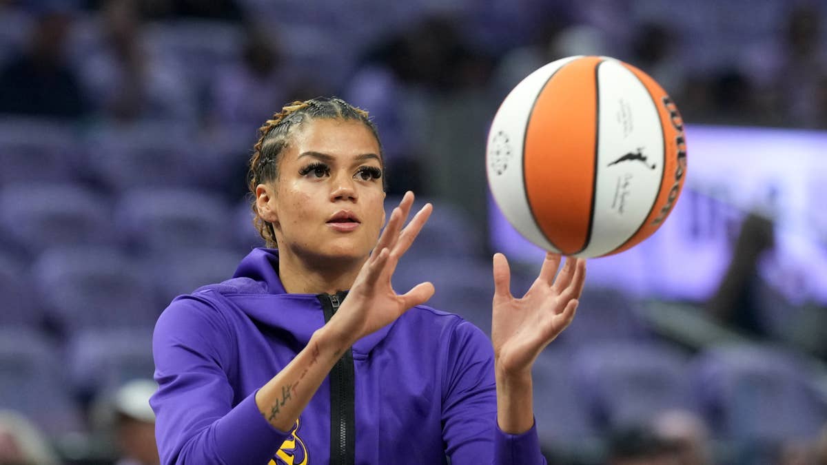 Rae Burrell turns heads in black lace-up romper before Sparks game