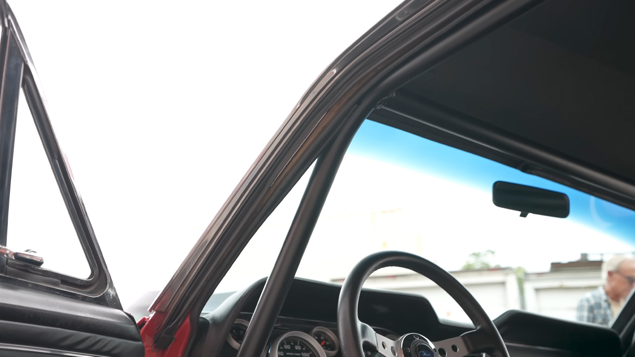 Exploring the rigid ten point safety roll cage Mustang fastback interior
