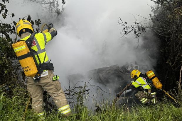 Dramatic scenes as car fire tackled next to A36