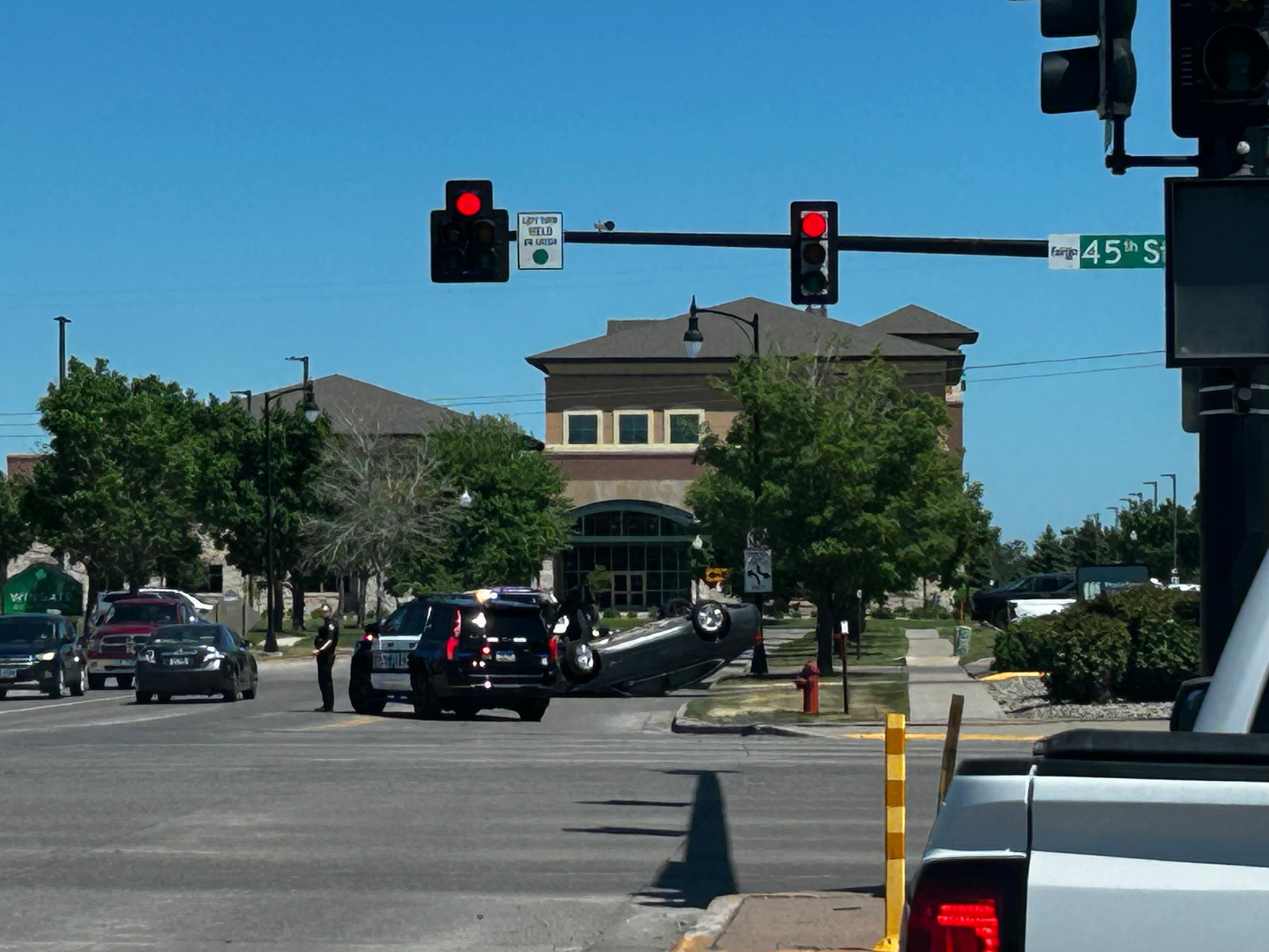Vehicle flips in Fargo crash, driver cited