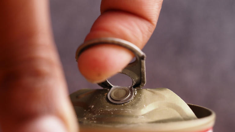 Use old metal lids to DIY garden tags on the cheap
