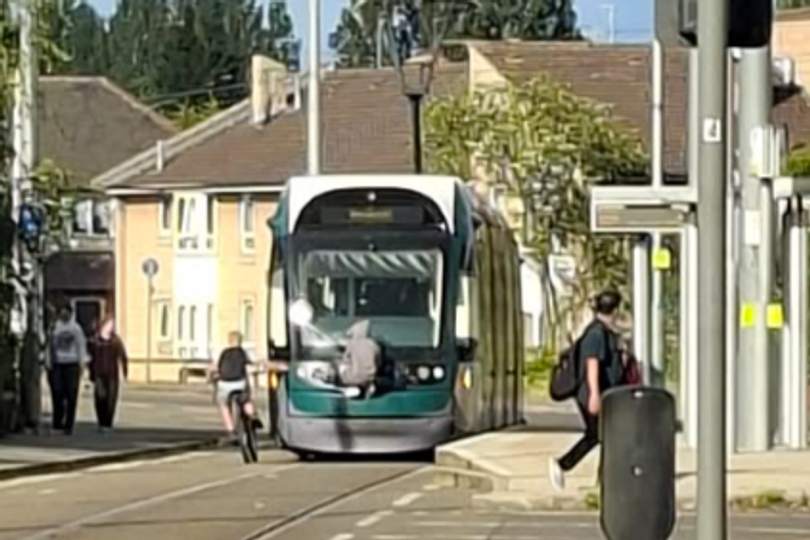 Warning issued after child seen holding onto back of running tram in ...
