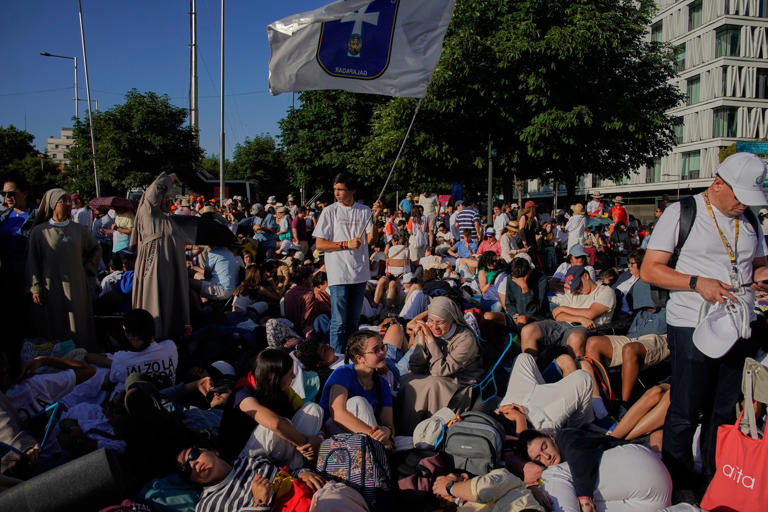 Pope's mass in Spain features iconic procession along flower-carpeted ...