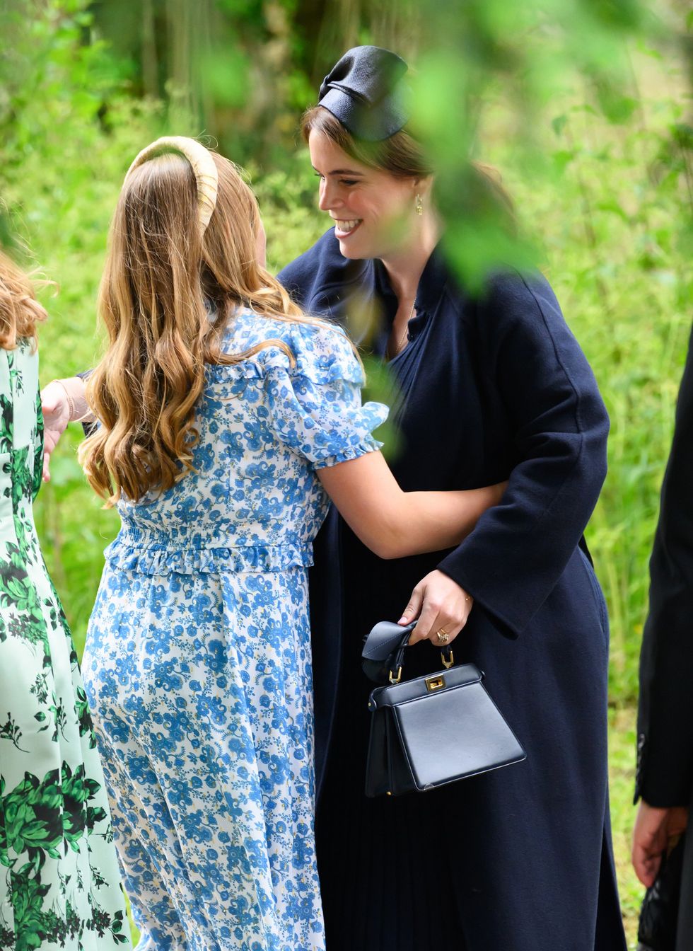 Mia and Lena Tindall steal show at royal wedding as pair shield from ...