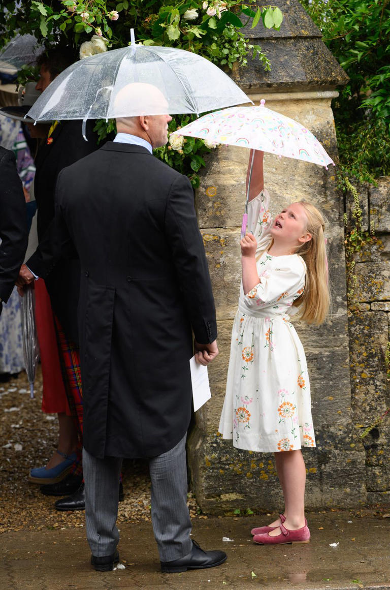 Mia and Lena Tindall steal show at royal wedding as pair shield from ...