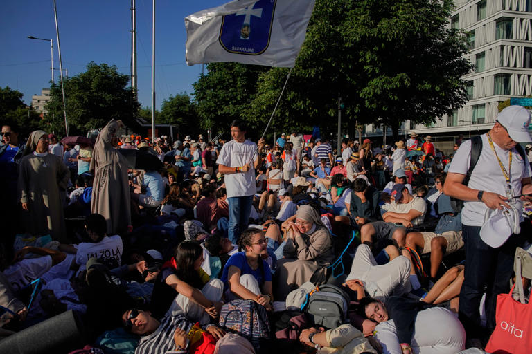 Pope's mass in Spain features iconic procession along flower-carpeted ...