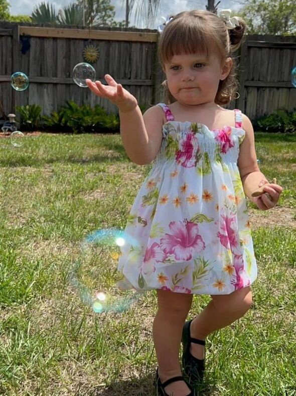 Girl, 1, dies after running into traffic on day out at beach