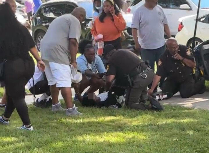Police hunt for gunmen after 12 people shot at community festival
