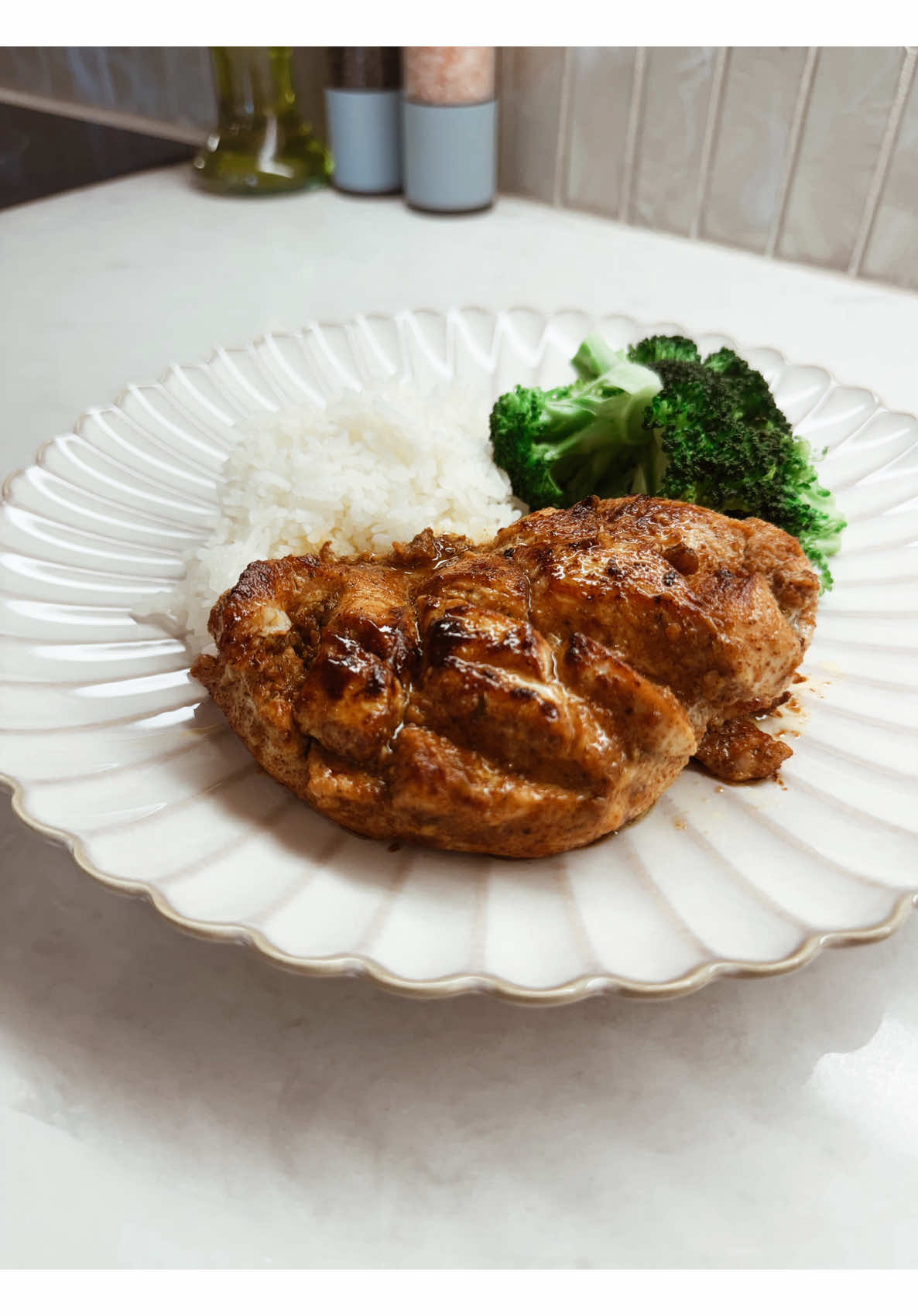A comforting pan fried chicken dinner with fluffy rice and tender ...