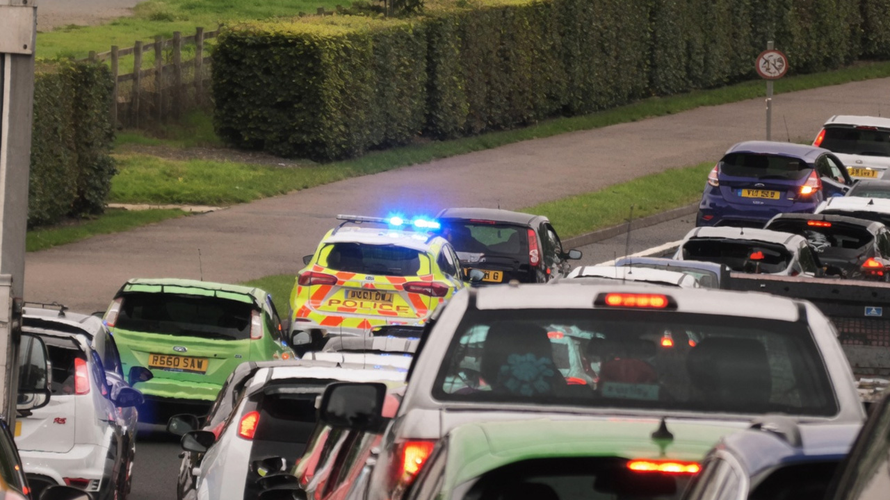 Police pull over Fiesta inside the massive fast Ford traffic jam