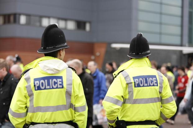 Violent thug who hit victim on the head with a baton is jailed